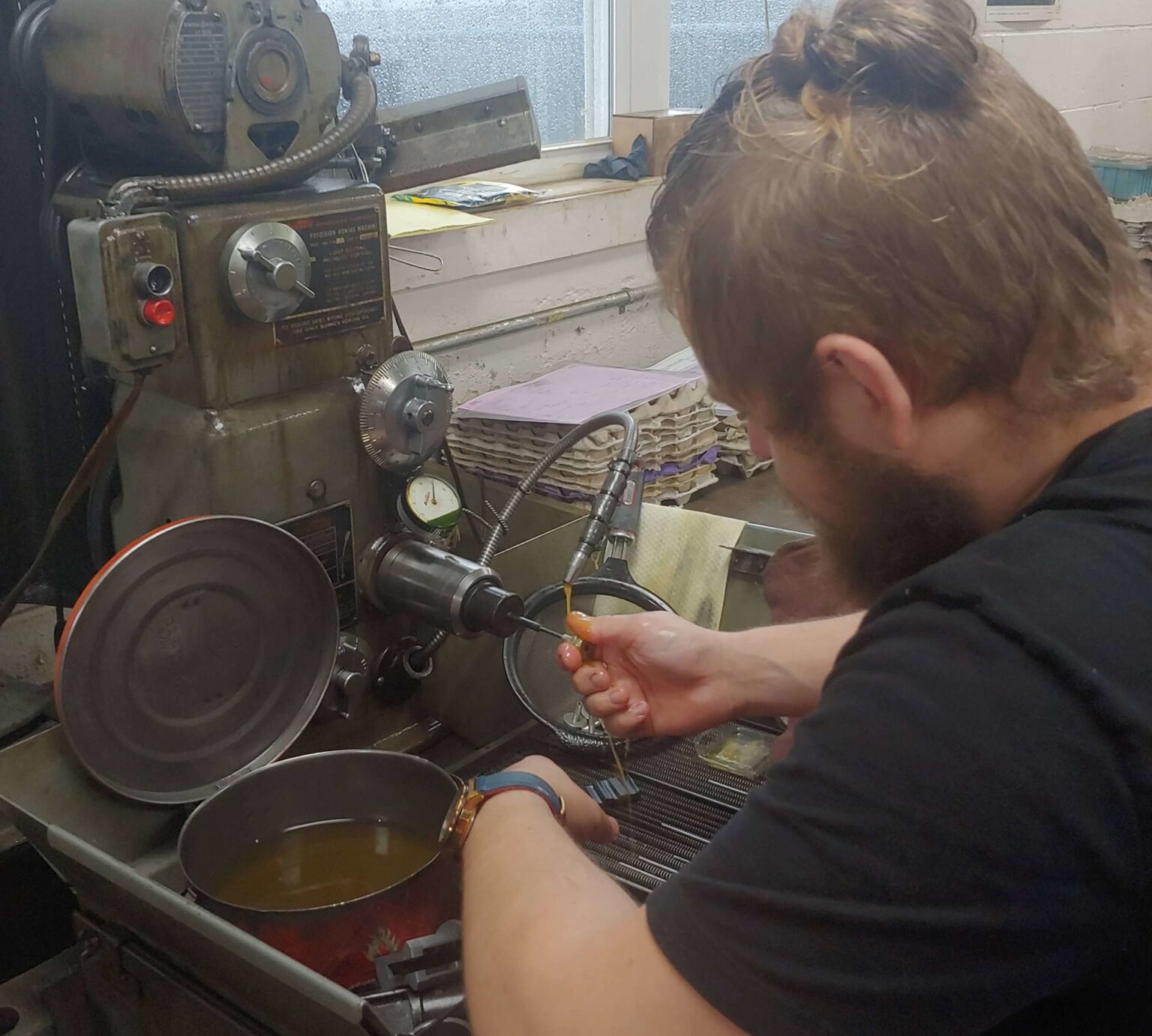 Dmitriy Golenev Performing a Honing Operation (1) (1) - Peerless Precision Inc.